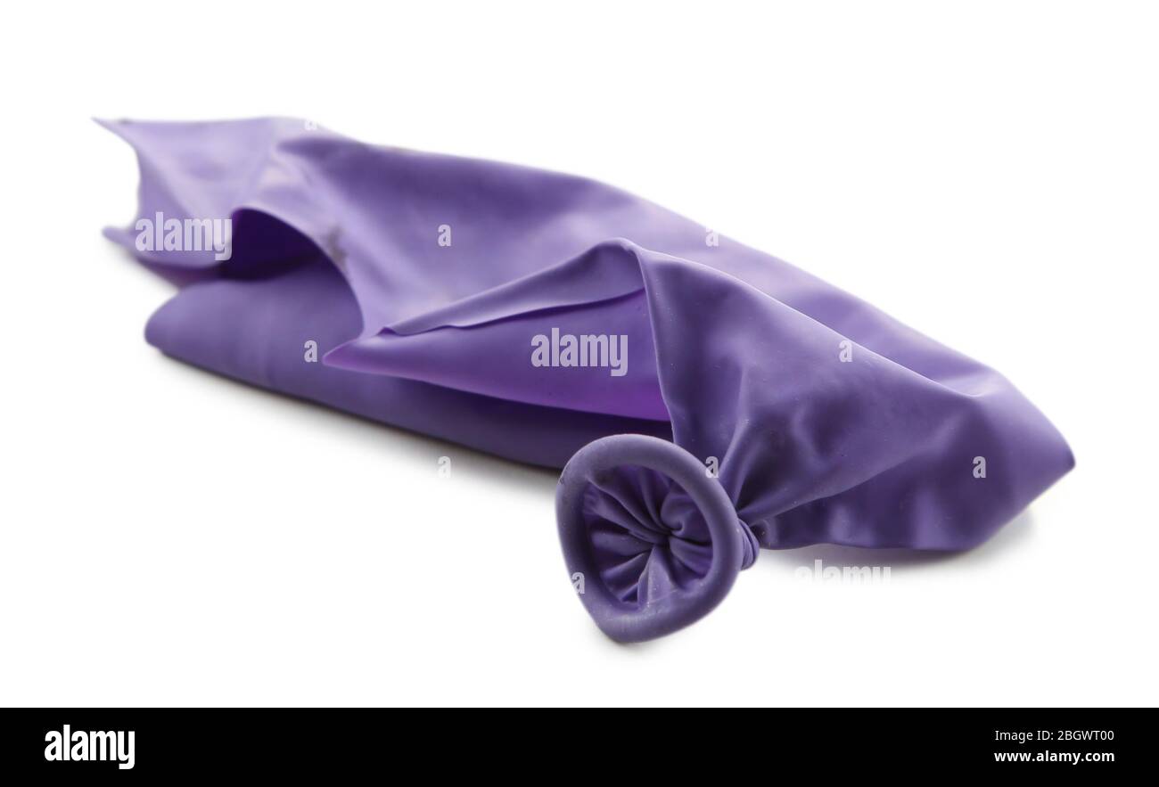 Popped violet balloon isolated on white Stock Photo - Alamy