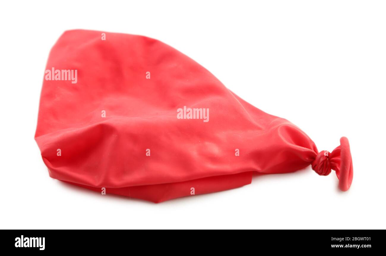 Popped red balloon isolated on white Stock Photo - Alamy