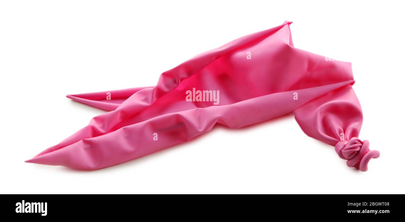 Popped pink balloon isolated on white Stock Photo - Alamy