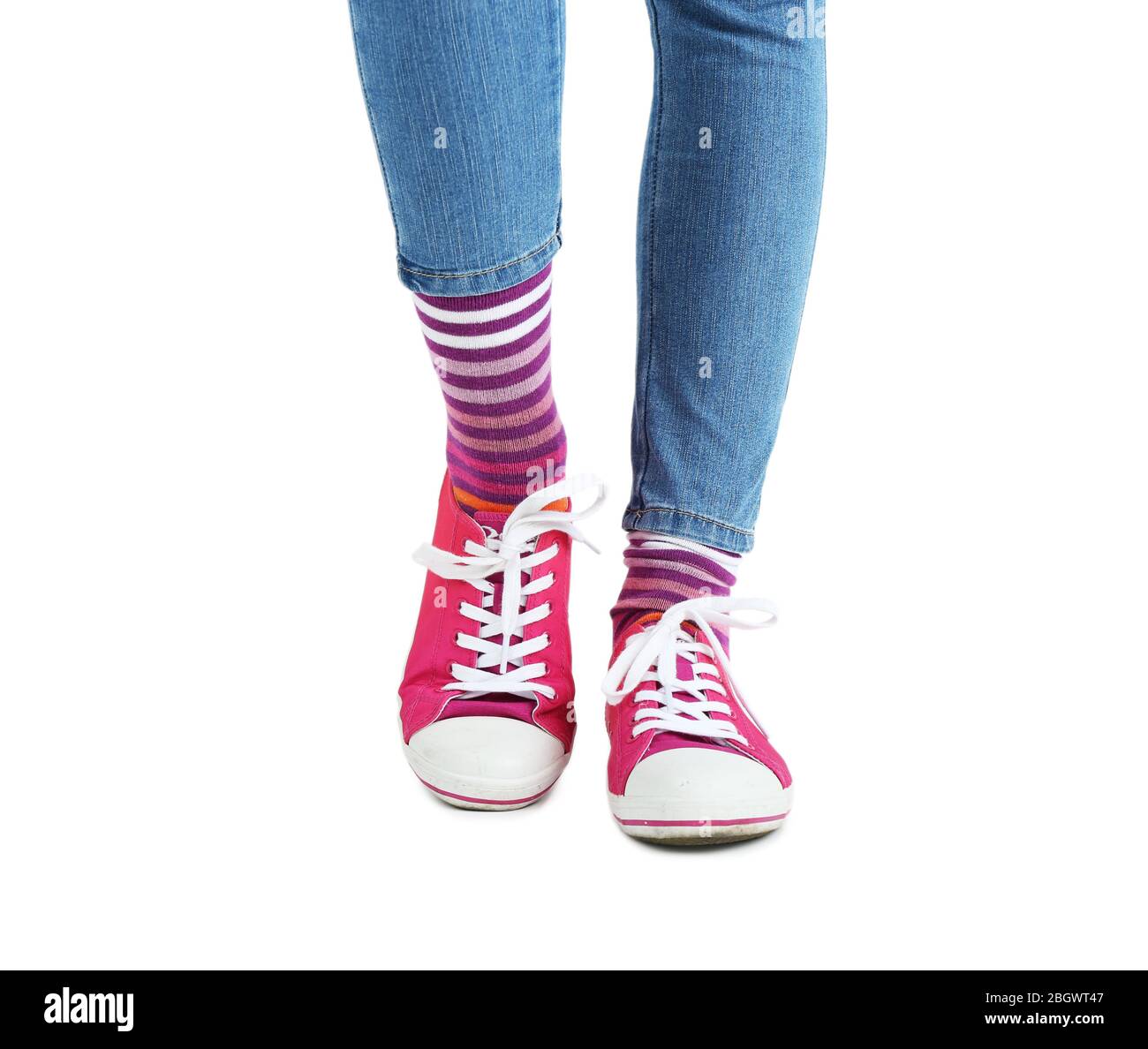 Female legs in colorful socks and sneakers isolated on white Stock ...