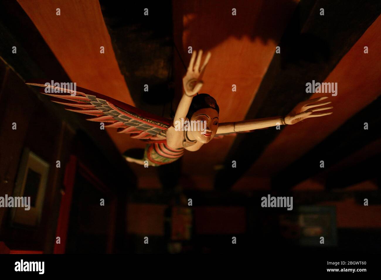 this wooden woman who flies above your head is made dramatic with good ...