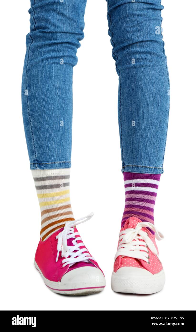Female legs in colorful socks and sneakers isolated on white Stock ...