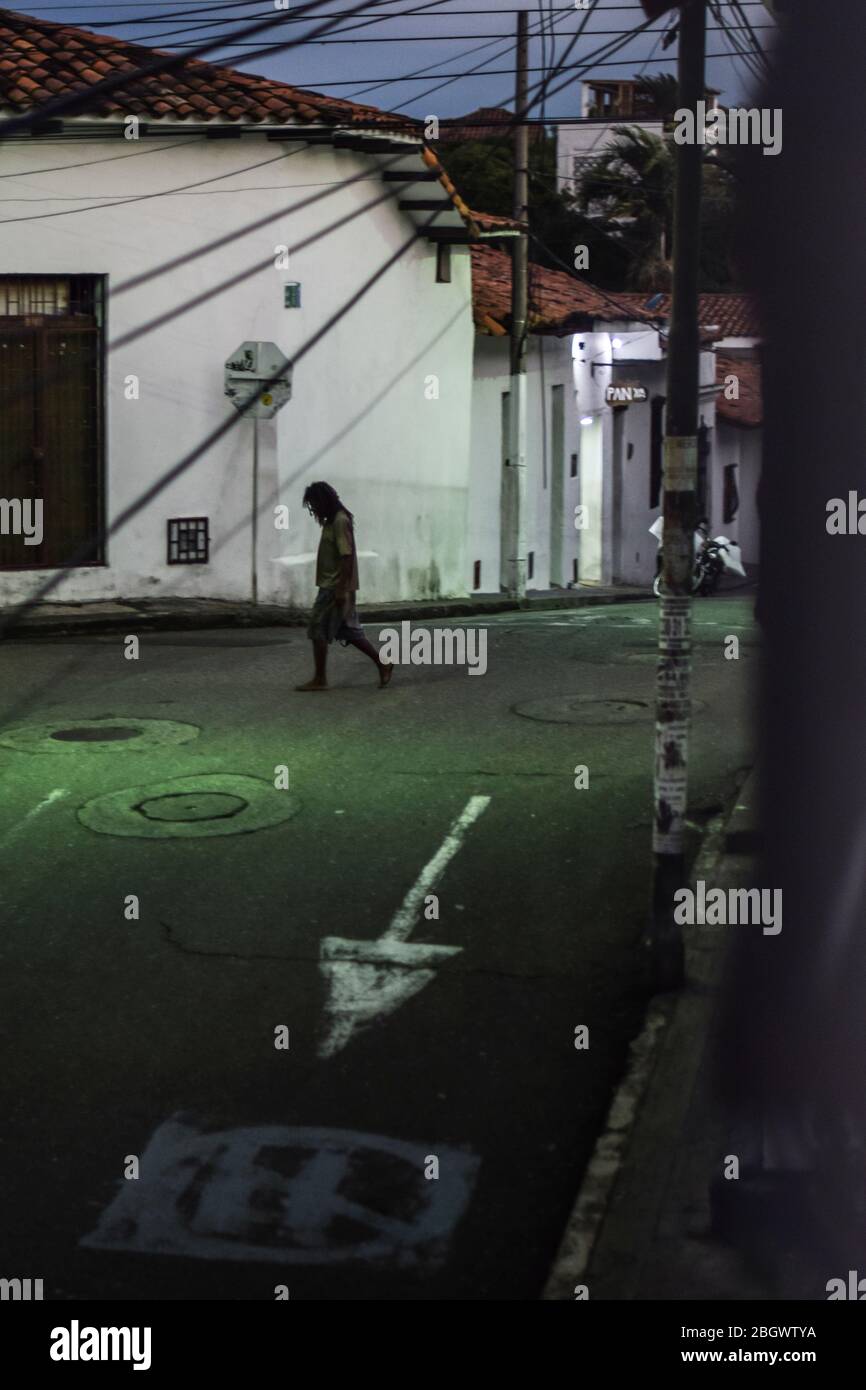 Homeless man walking the empty streets of Cali, Colombia Stock Photo ...