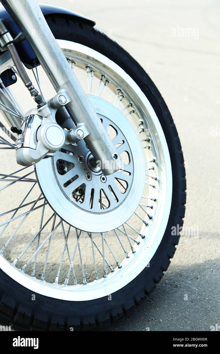 Motorcycle forks and tire, close-up Stock Photo - Alamy