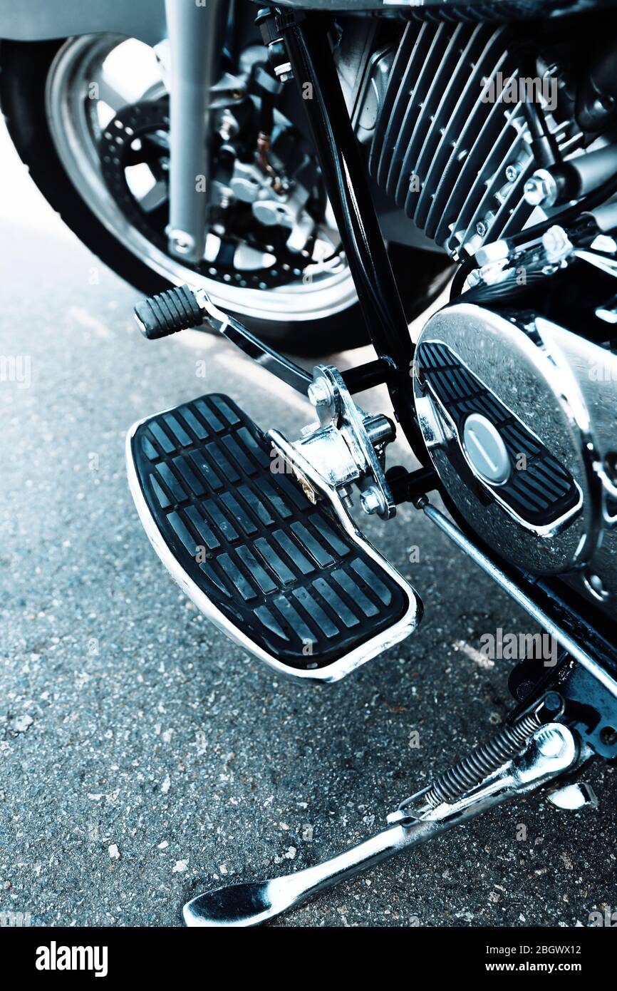 Detail with the foot-rest of motorcycle Stock Photo - Alamy