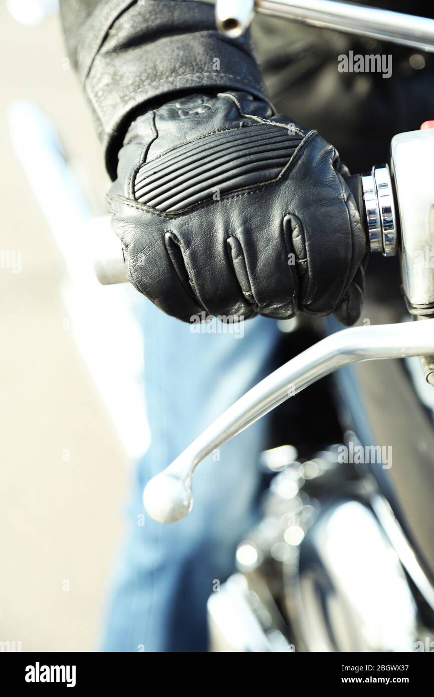 Hand rider on handlebars, close-up Stock Photo - Alamy