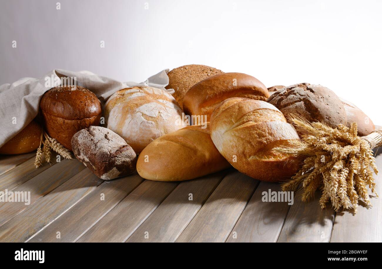Fresh bread on table on white background Stock Photo - Alamy