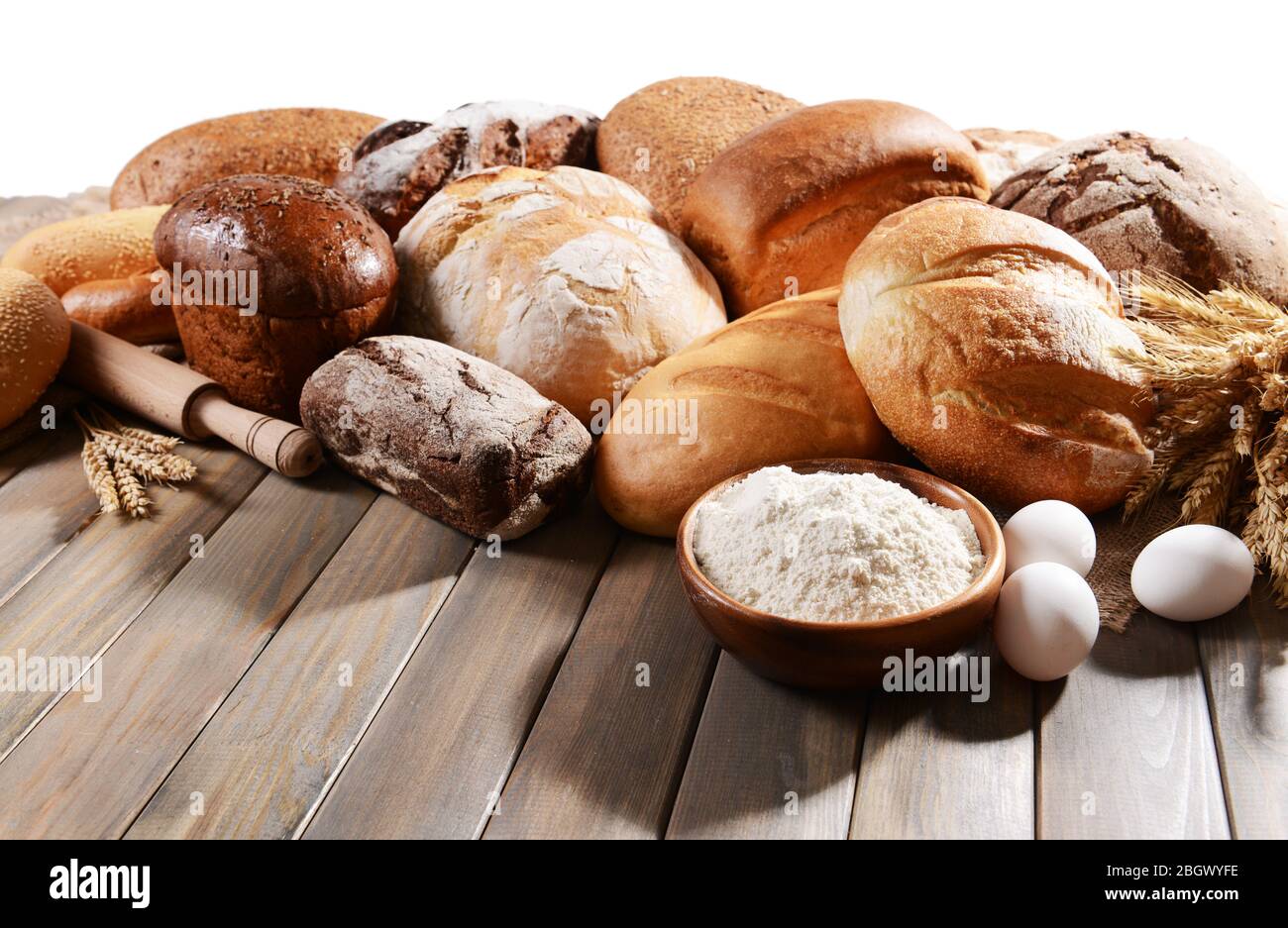 Fresh bread on table on white background Stock Photo - Alamy