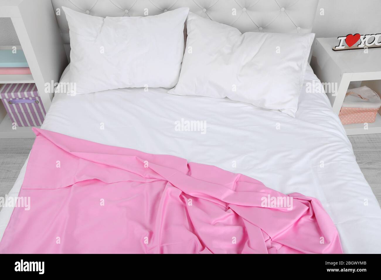 Crumpled pink linen on bed Stock Photo - Alamy