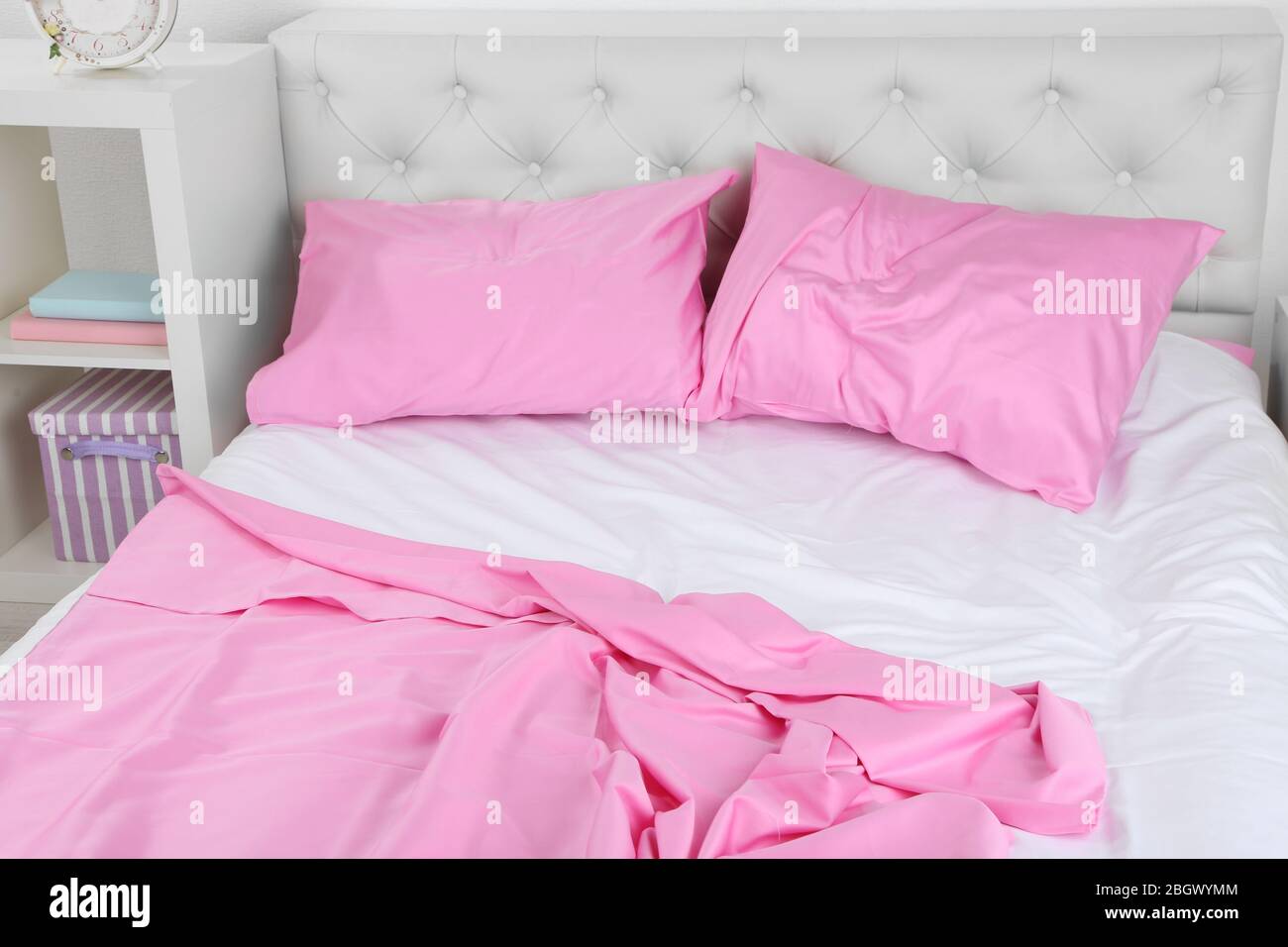Crumpled pink linen on bed Stock Photo - Alamy