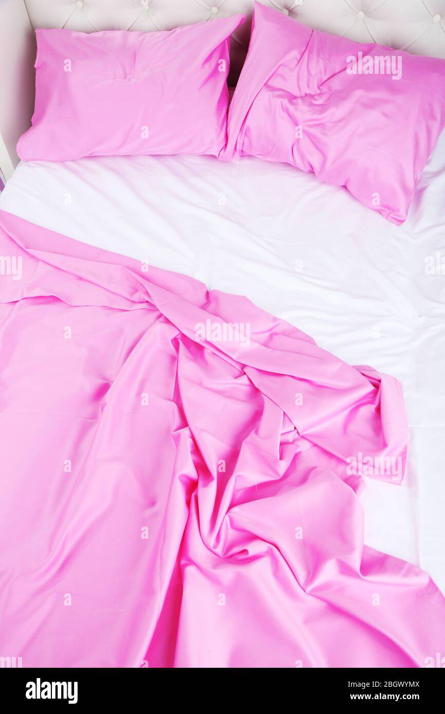 Crumpled pink linen on bed Stock Photo - Alamy
