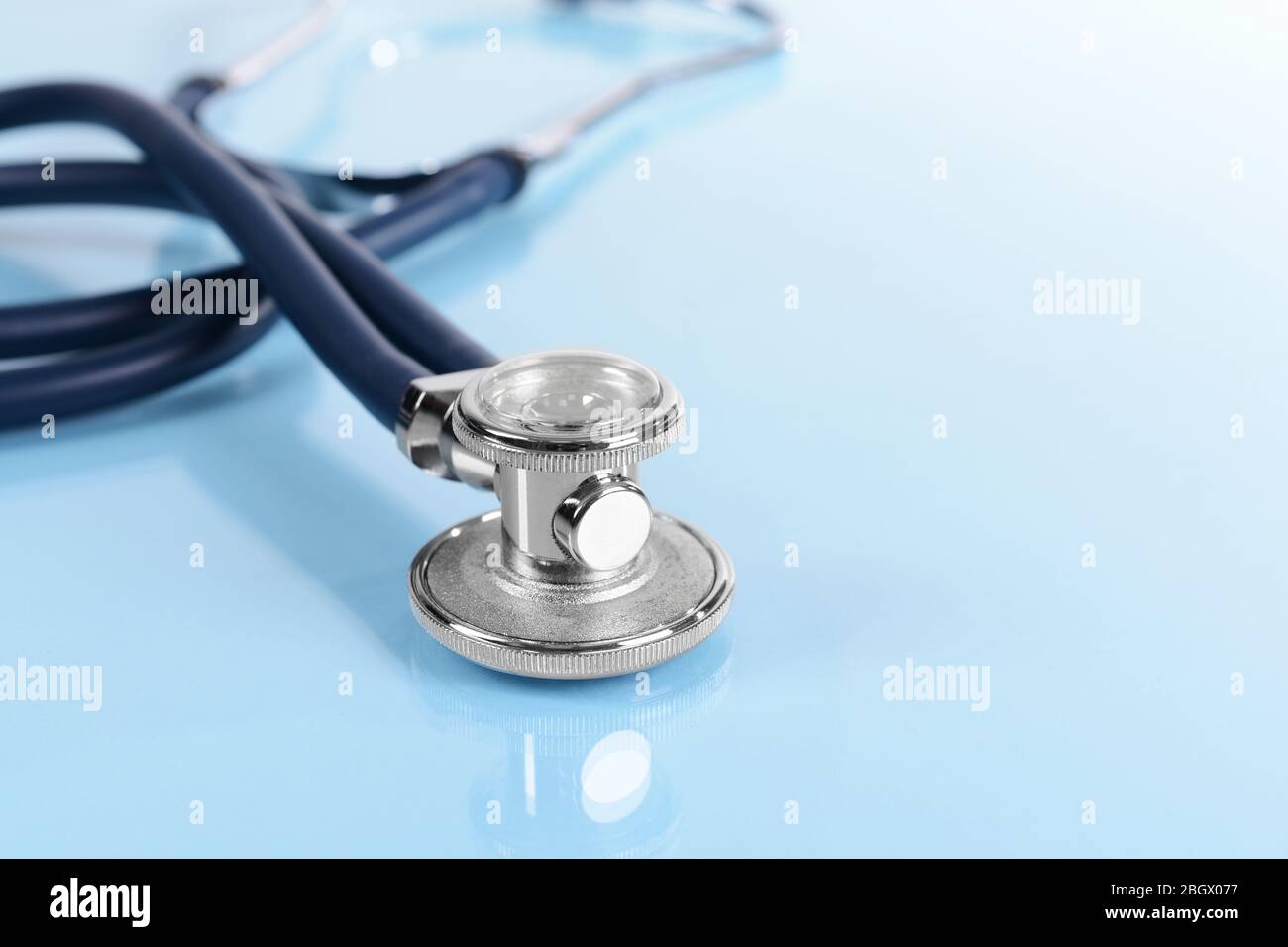 Stethoscope on light blue background Stock Photo - Alamy