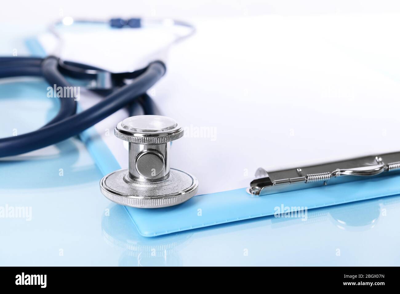 Stethoscope on light blue background Stock Photo - Alamy