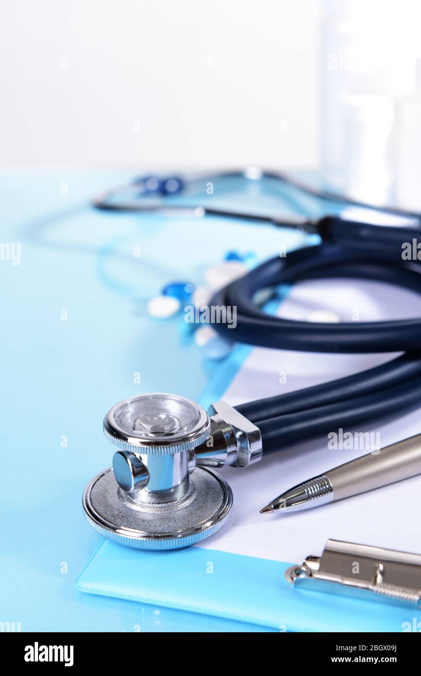 Stethoscope on light blue background Stock Photo - Alamy