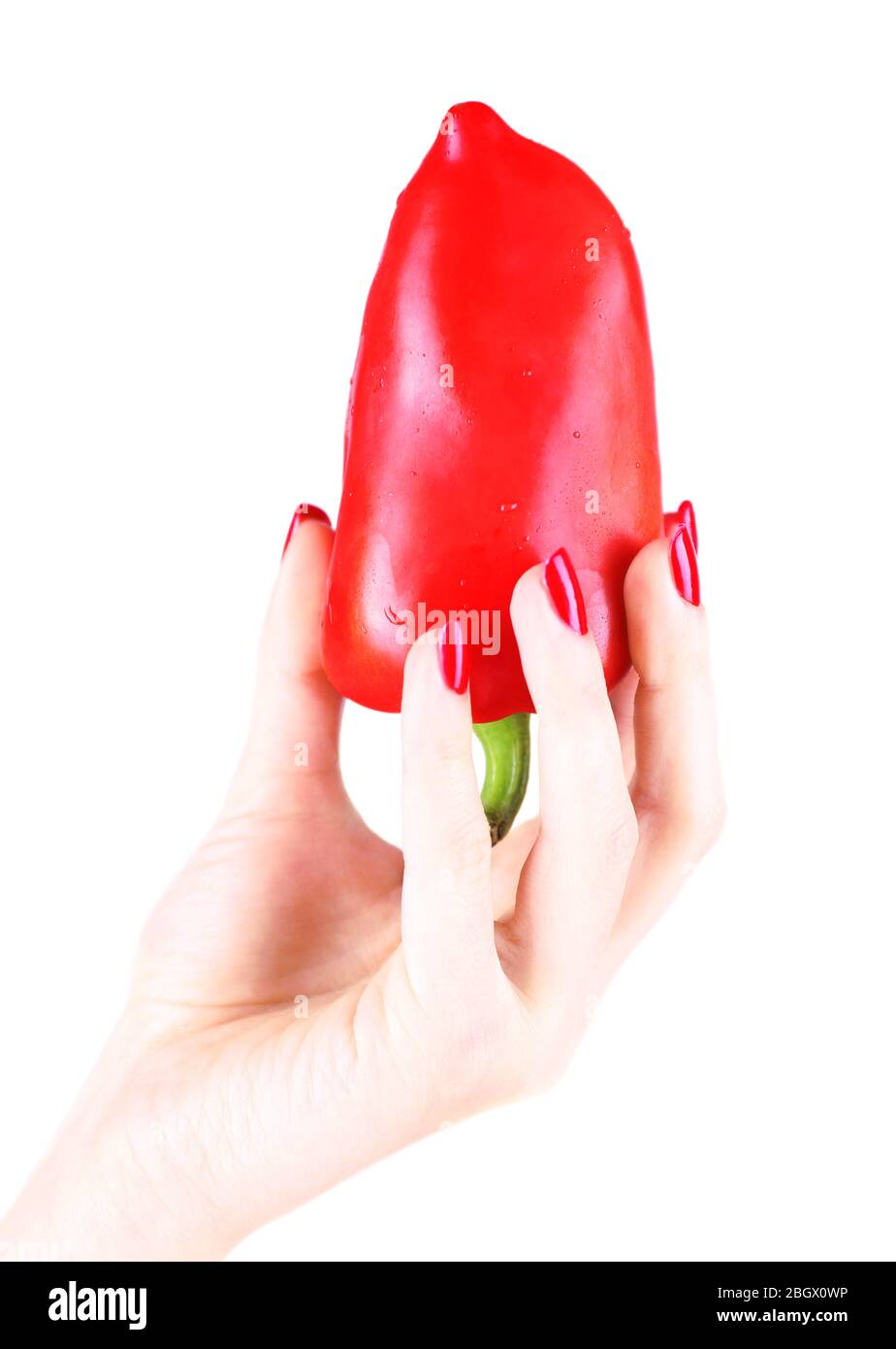 Woman's hand holding pepper isolated on white Stock Photo - Alamy