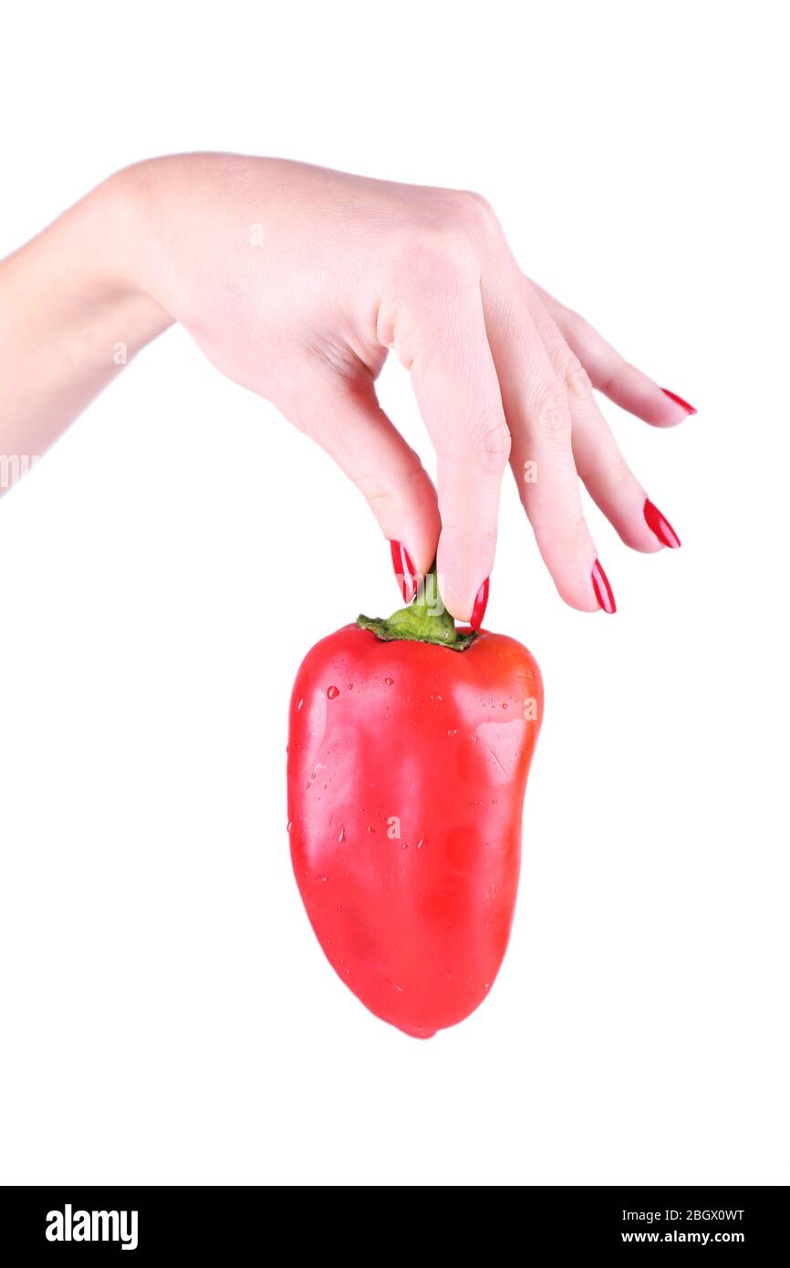 Woman's hand holding pepper isolated on white Stock Photo - Alamy