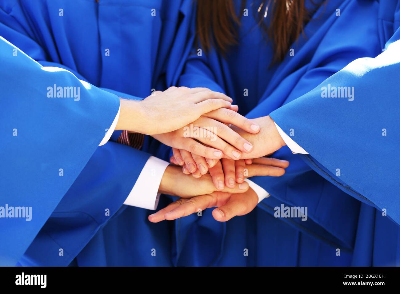 Happy graduate hands up hi-res stock photography and images - Alamy