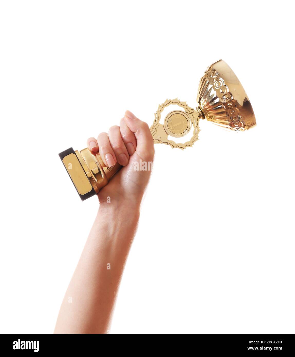 Gold cup in hand isolated on white Stock Photo - Alamy