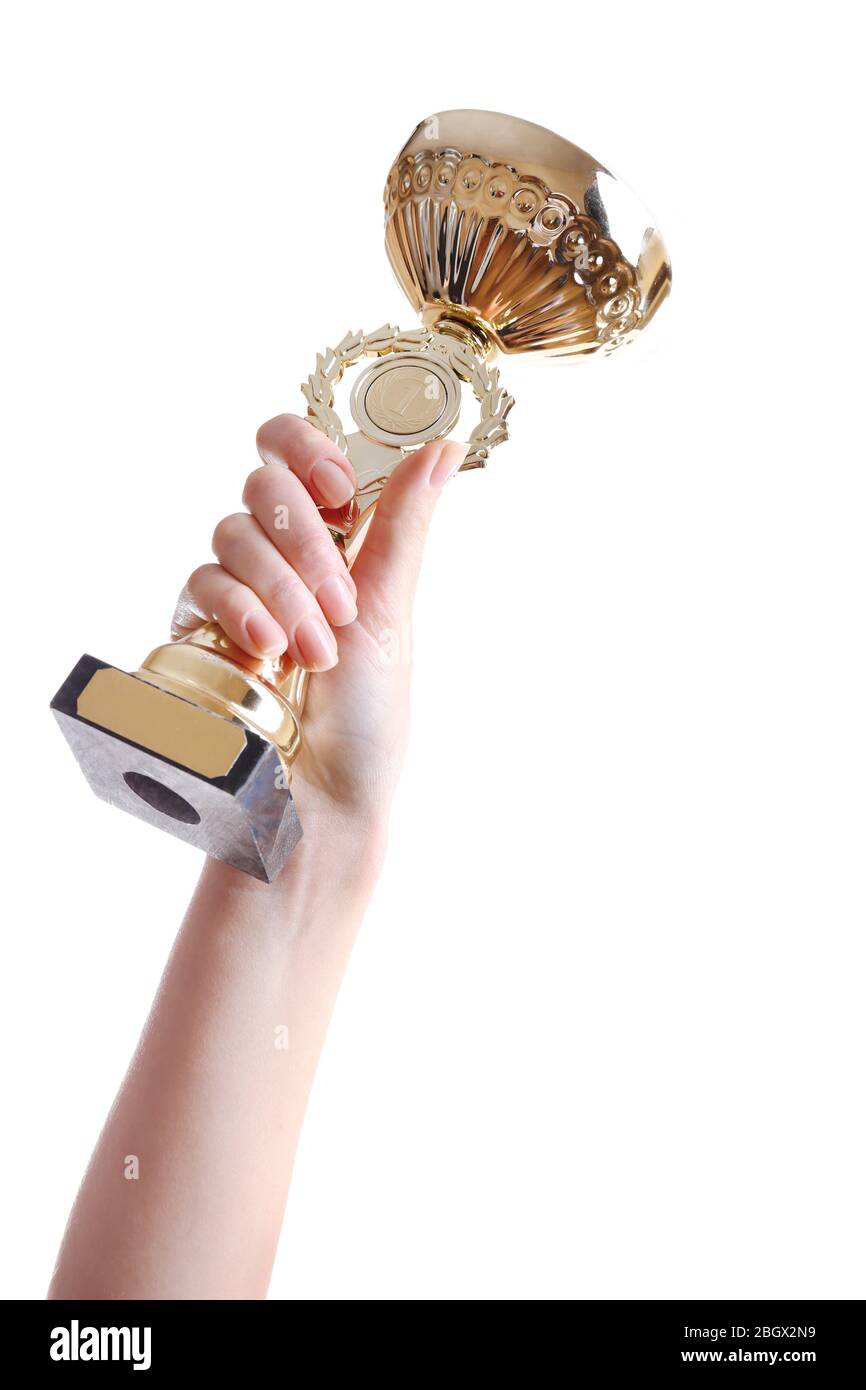 Gold cup in hand isolated on white Stock Photo - Alamy