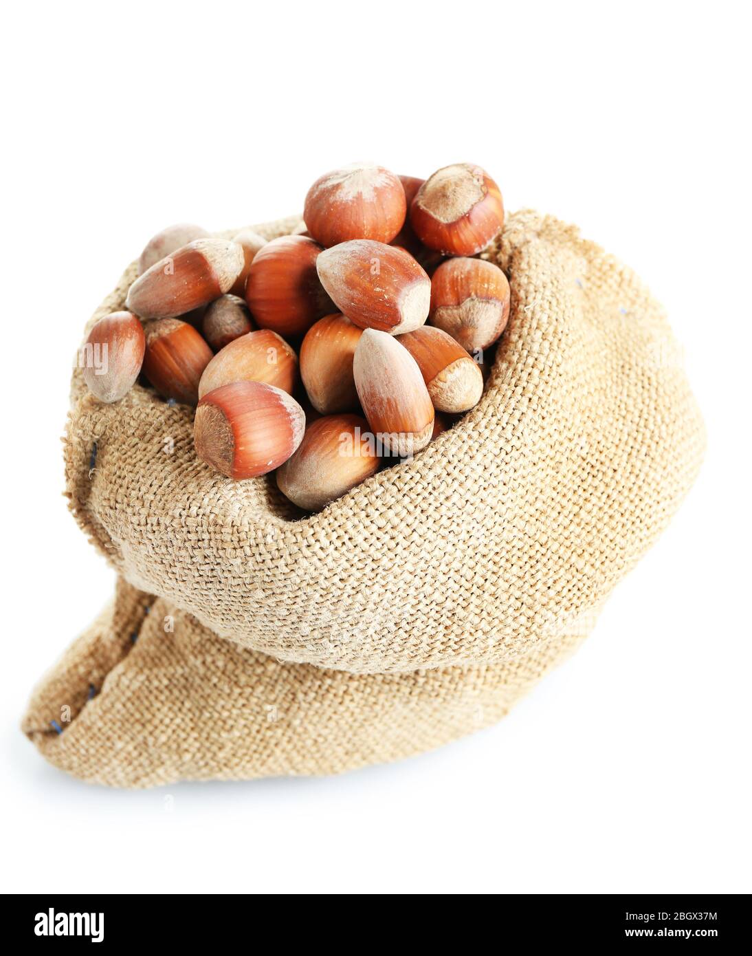 Hazelnuts in bag isolated on white Stock Photo - Alamy