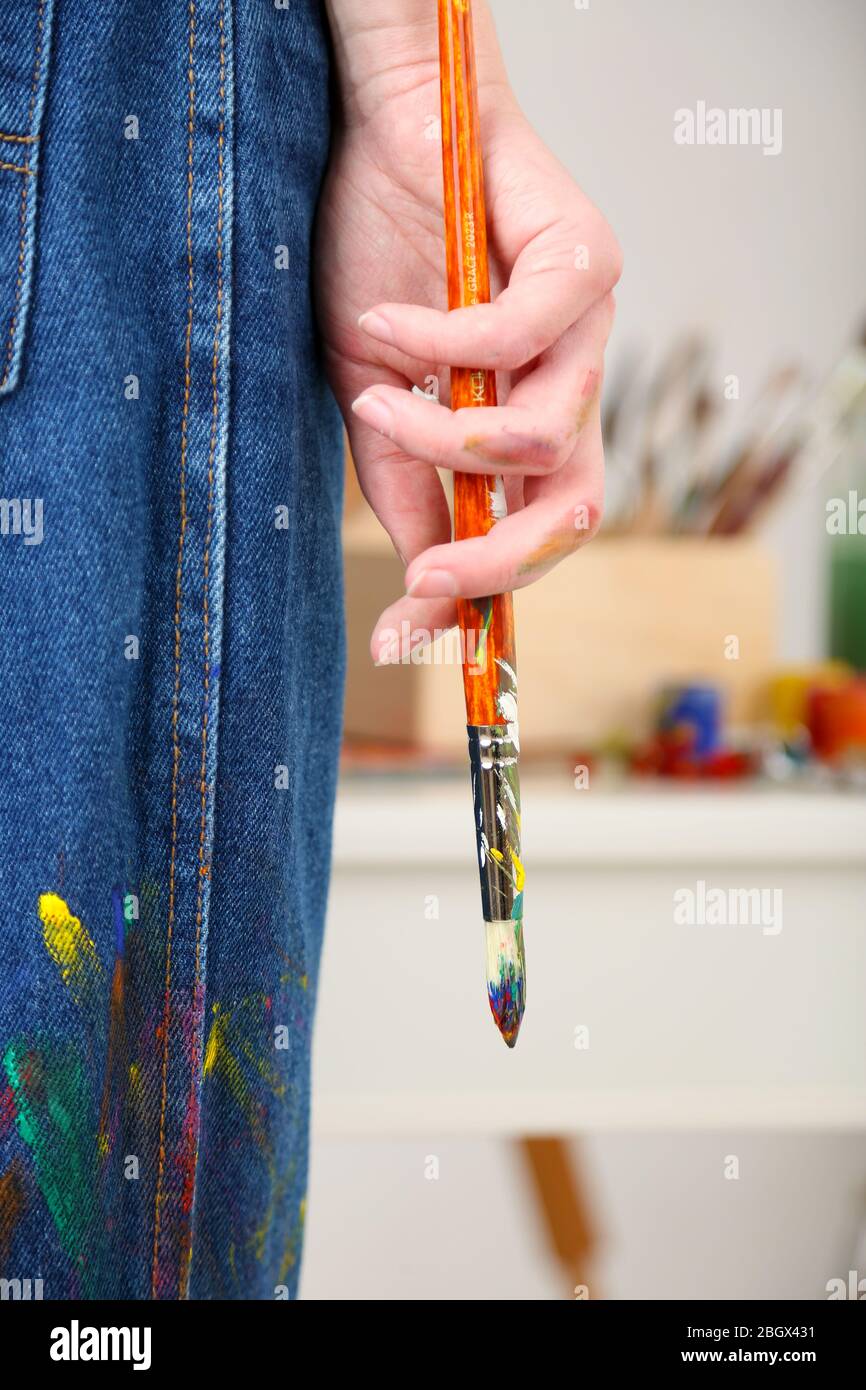 Artist holding paintbrush in hi-res stock photography and images - Alamy