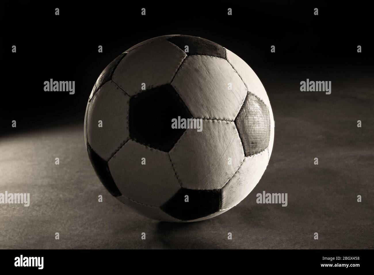 Soccer ball on black background Stock Photo - Alamy