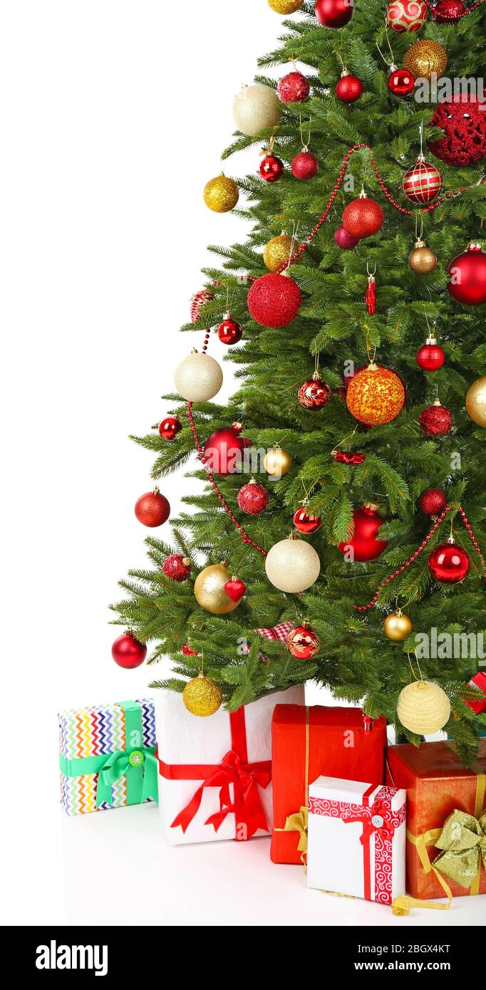 Decorated Christmas tree with gifts isolated on white Stock Photo - Alamy