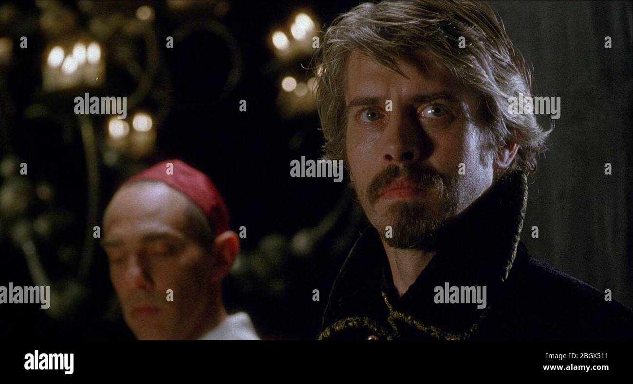 London.UK. Derek Jarman (playing a priest) and Nigel Terry as ...