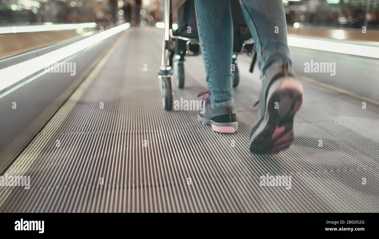 Woman with Luggage Truck Walk at Airport Terminal. Tracking Shot of ...