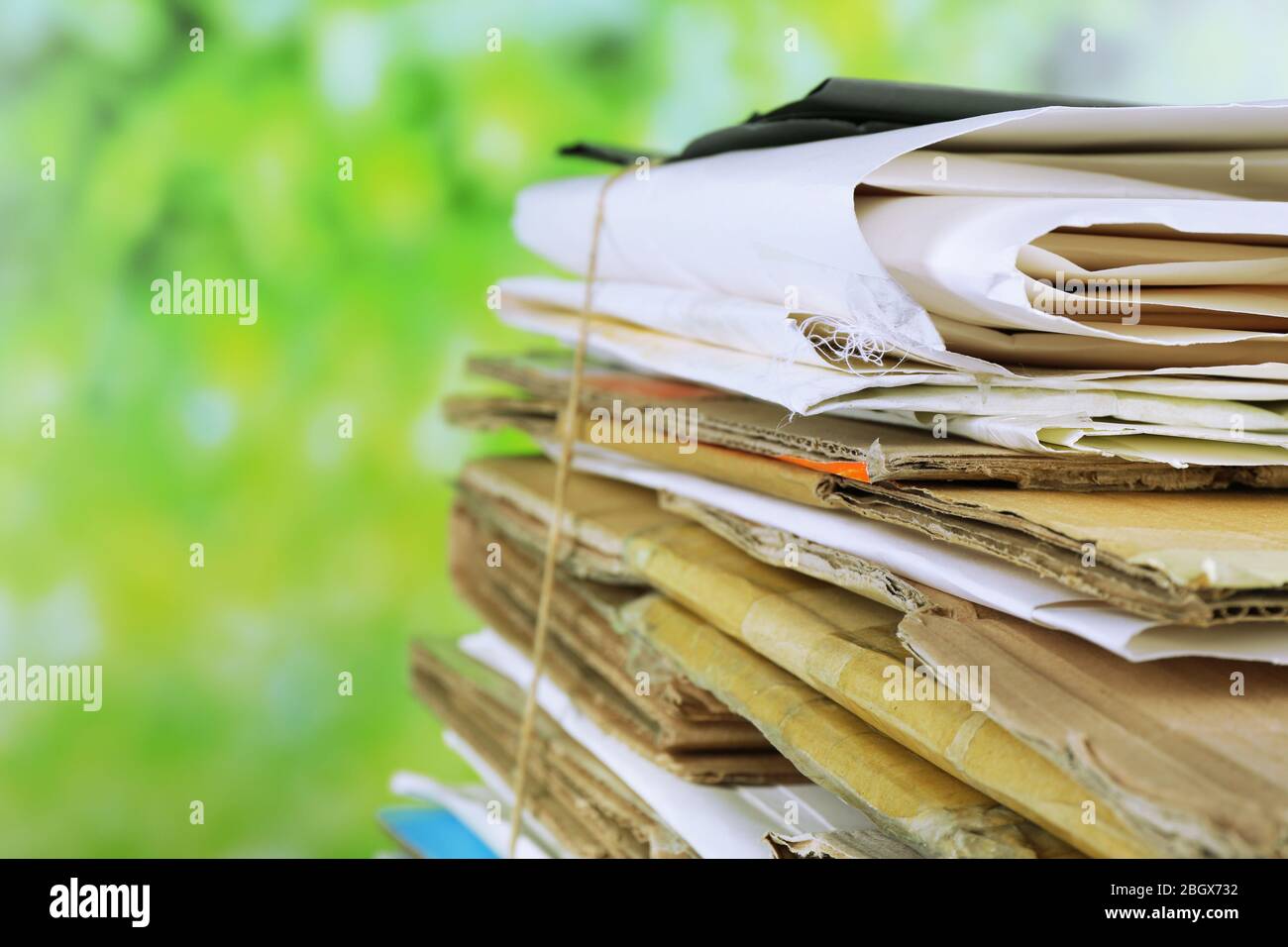 Big stack of papers on green background, close-up Stock Photo - Alamy
