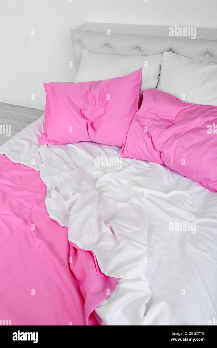 Crumpled pink linen on bed Stock Photo - Alamy