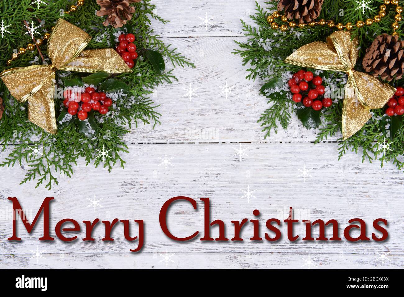 Beautiful Christmas border from fir and mistletoe on wooden background ...