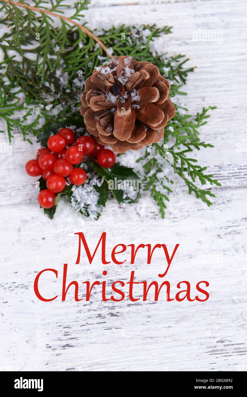 Beautiful Christmas border from fir and mistletoe on wooden background ...