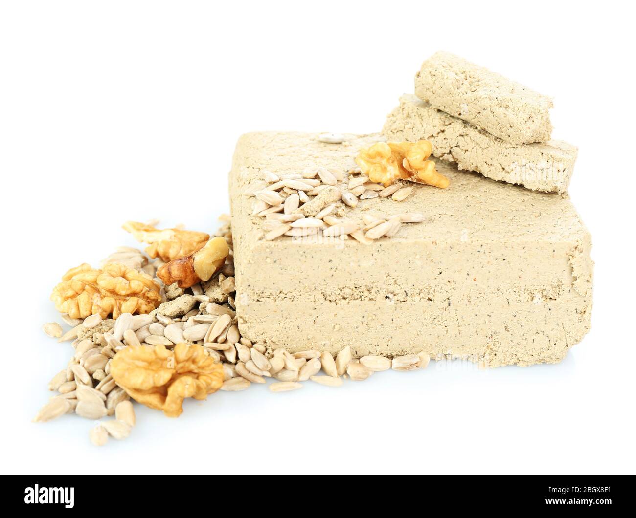 Sunflower halva with nuts isolated on white background Stock Photo - Alamy