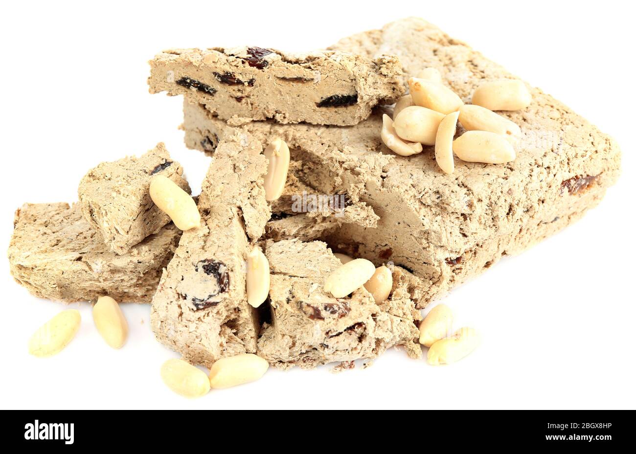 Sunflower halva with peanuts and raisins isolated on white background ...