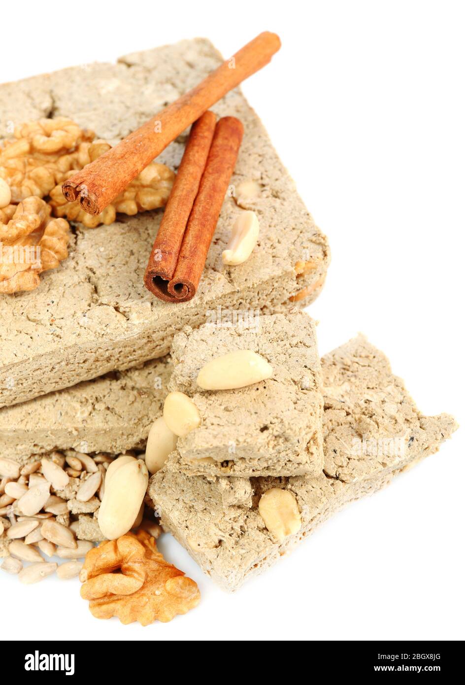 Sunflower halva with nuts and cinnamon isolated on white background ...
