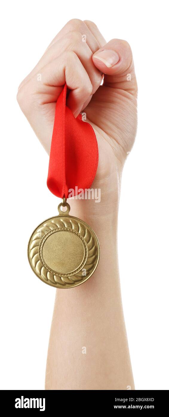 Golden medal in hand isolated on white Stock Photo - Alamy