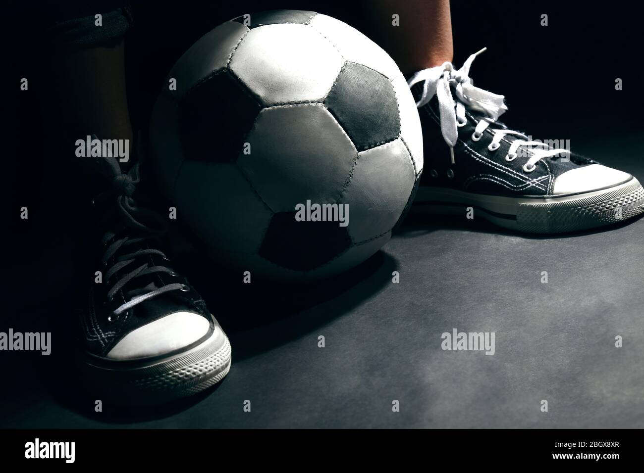 Soccer ball on black background Stock Photo - Alamy