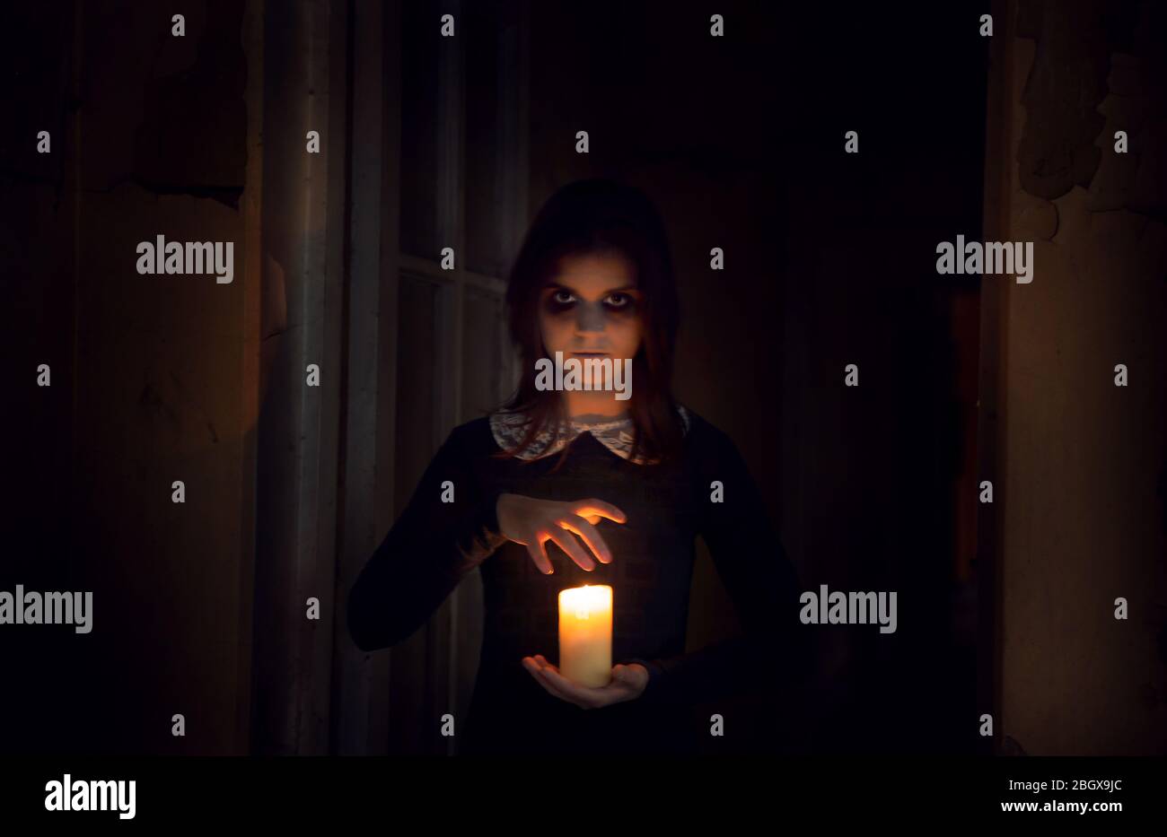 Horror Scene of with scary woman with candle Stock Photo - Alamy