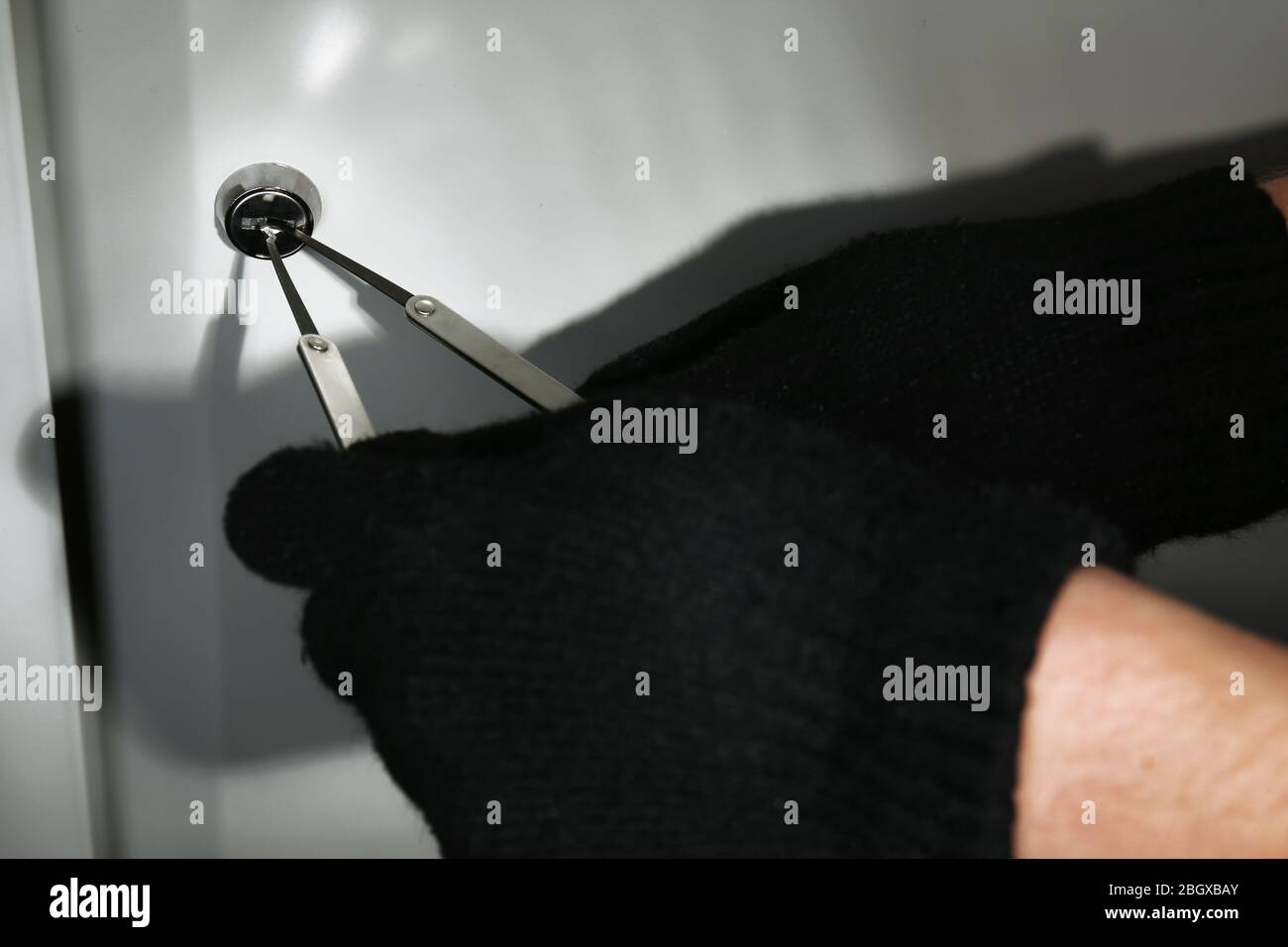 Picking a lock Stock Photo - Alamy