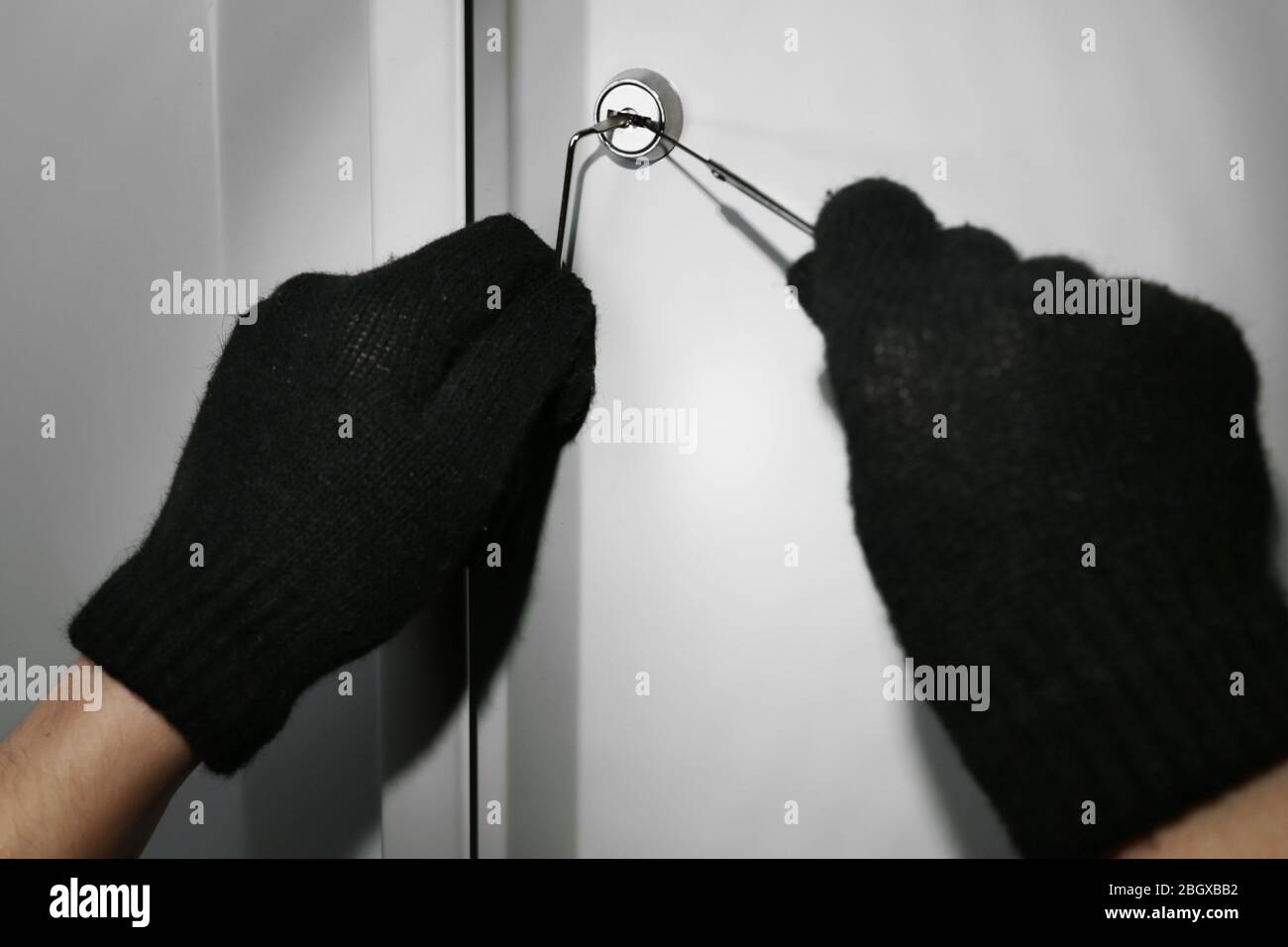 Picking a lock Stock Photo - Alamy