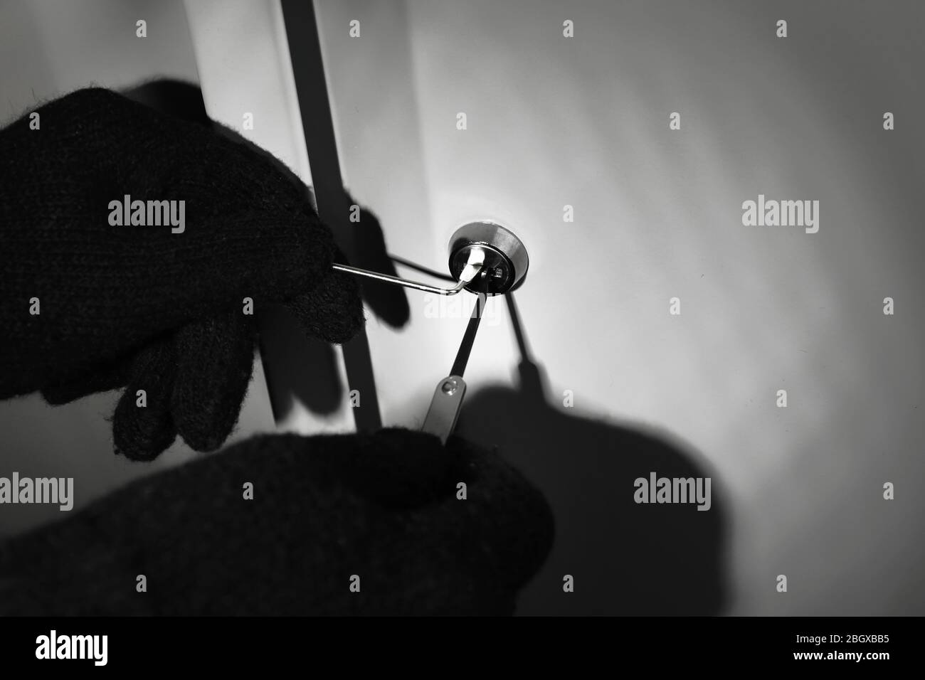 Picking a lock Stock Photo - Alamy
