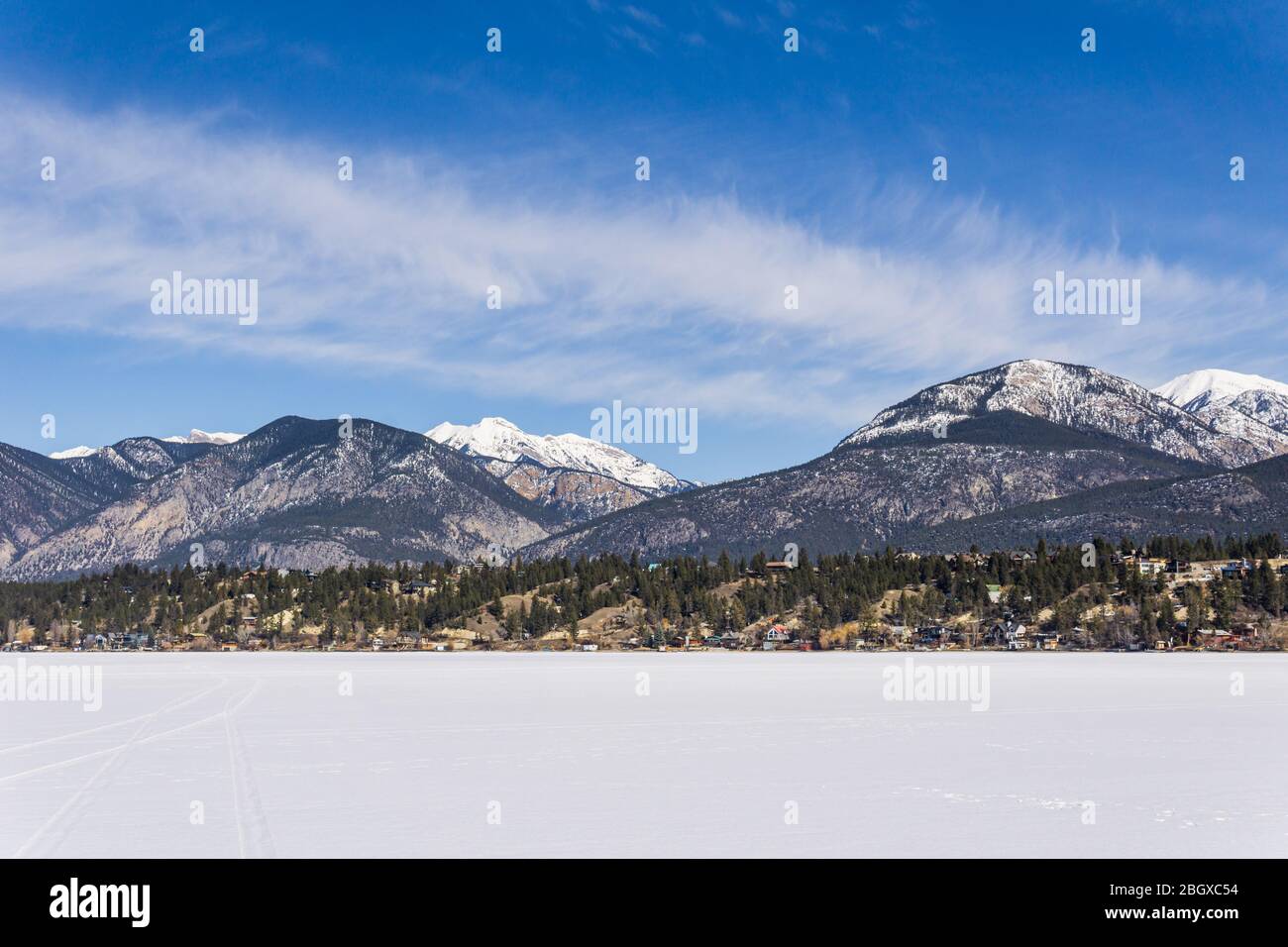 frozen Windermere lake and rocky mountains in british columbia canada ...