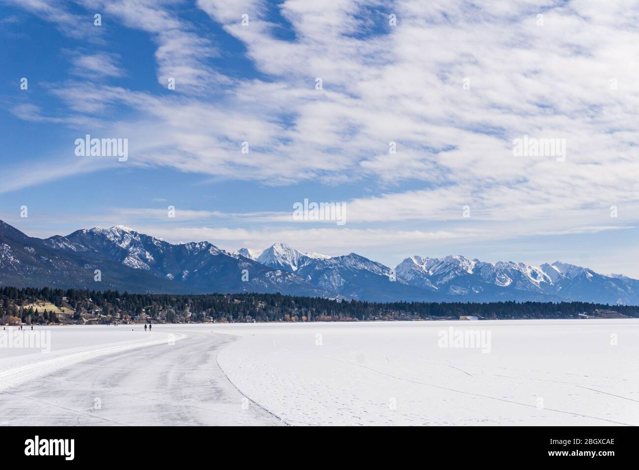 frozen Windermere lake and rocky mountains in british columbia canada ...