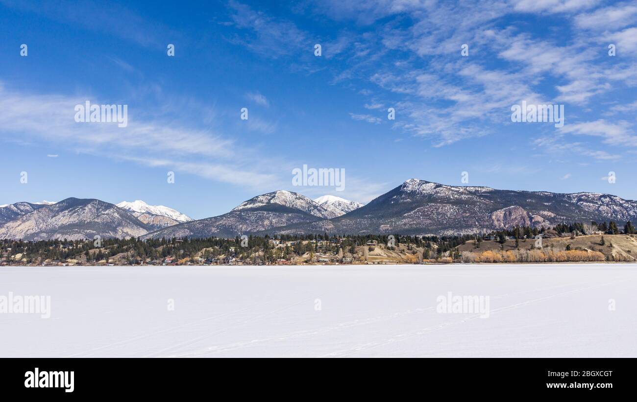 frozen Windermere lake and rocky mountains in british columbia canada ...