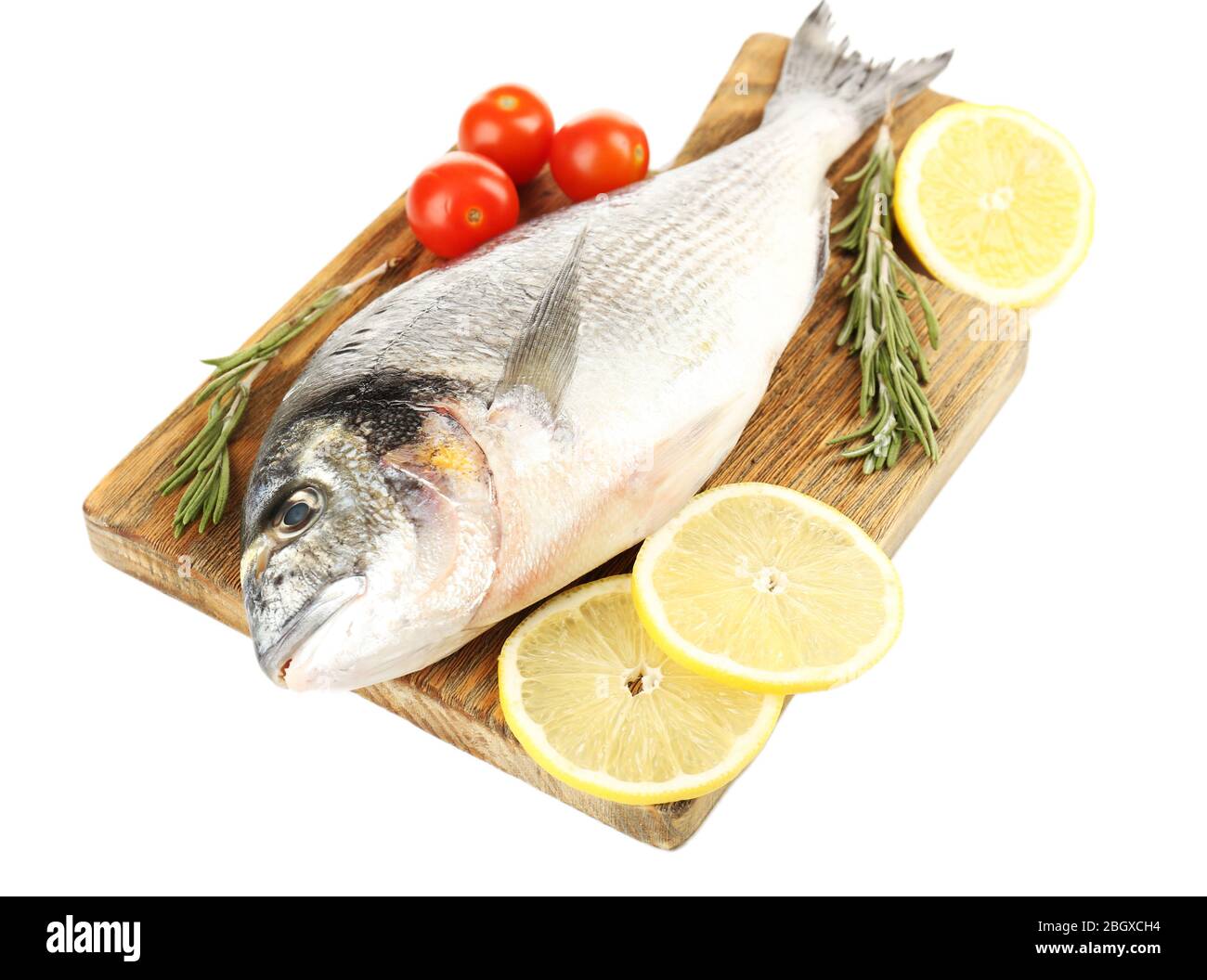 Fresh raw fish on cutting board and food ingredients isolated on white ...
