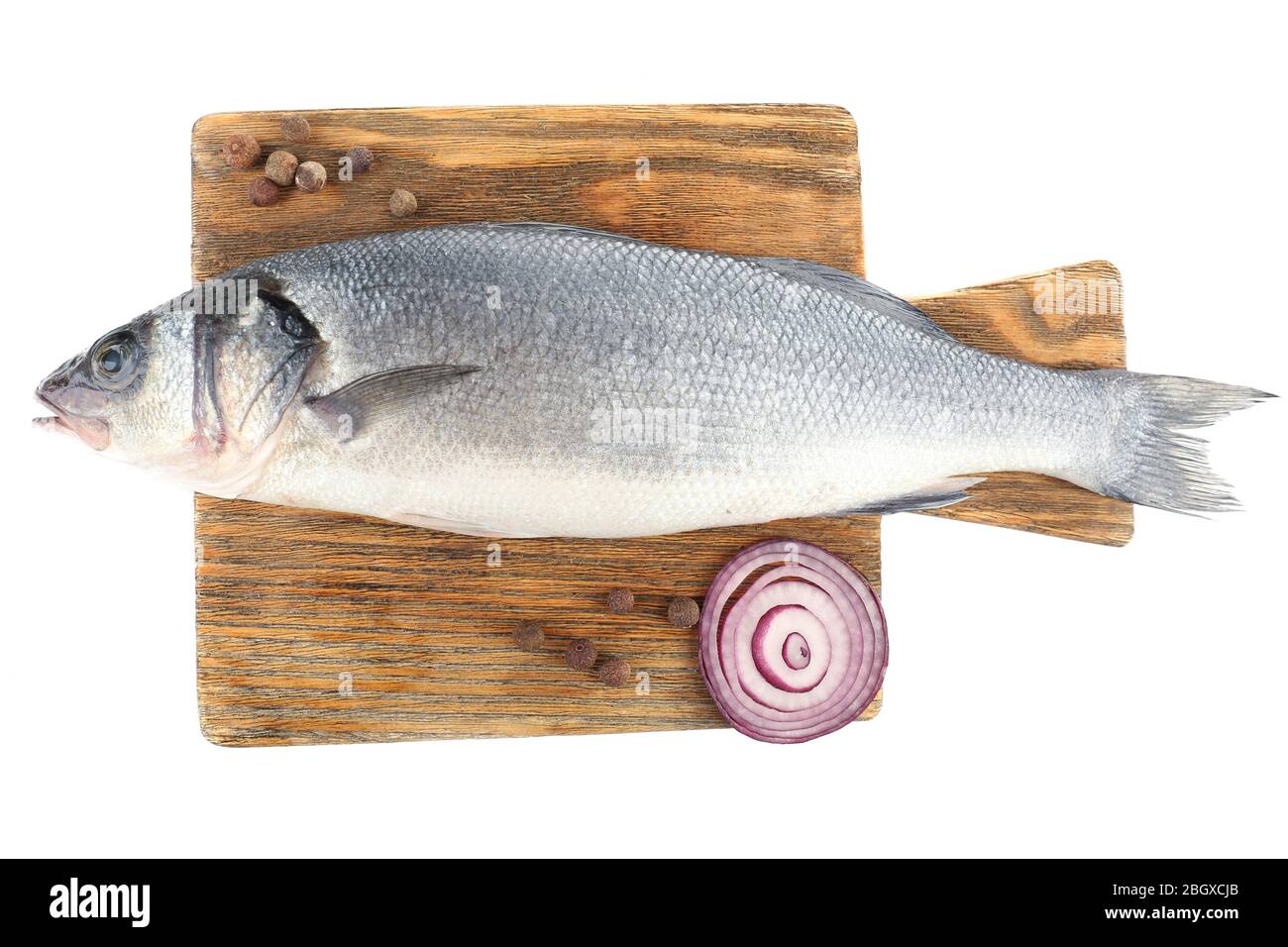 Fresh raw fish on cutting board and food ingredients isolated on white ...