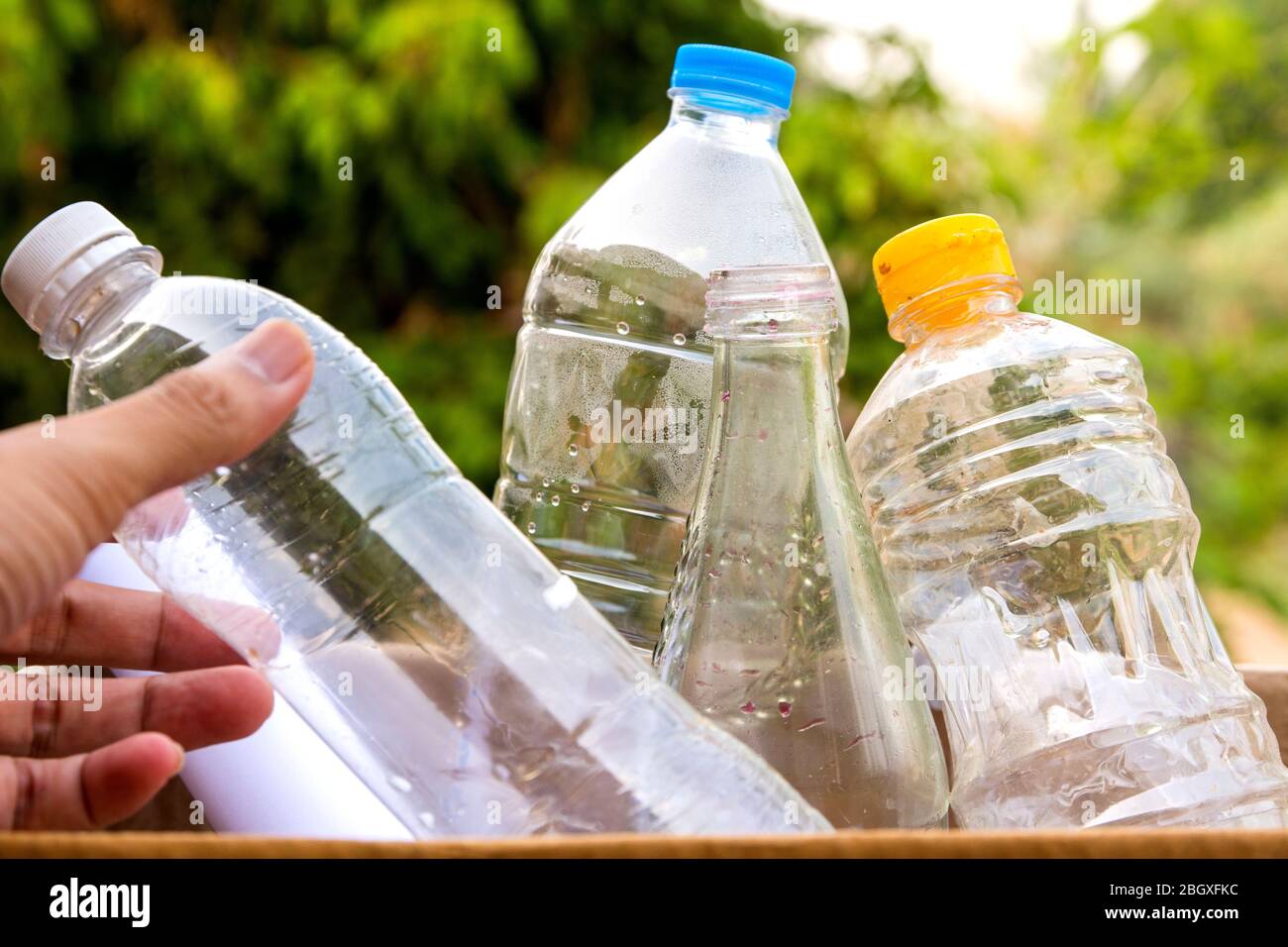hand holding plastic recycle for cleaning Stock Photo - Alamy