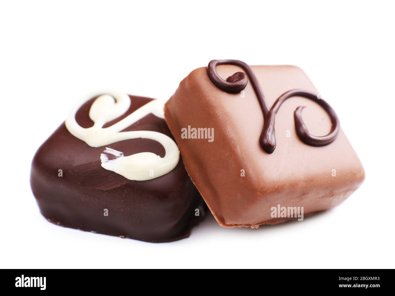 Delicious chocolate candy isolated on white Stock Photo - Alamy