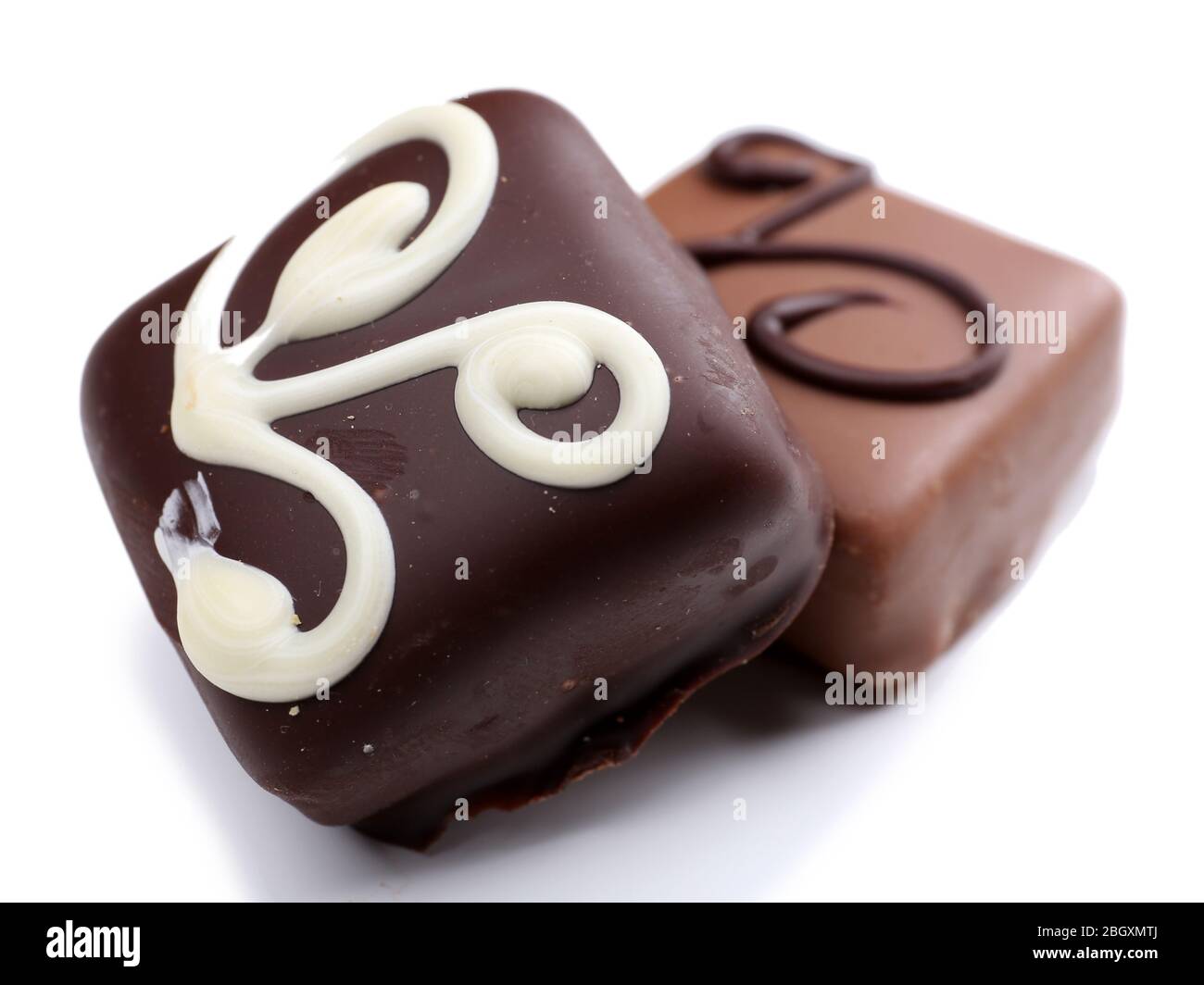 Delicious chocolate candy isolated on white Stock Photo - Alamy